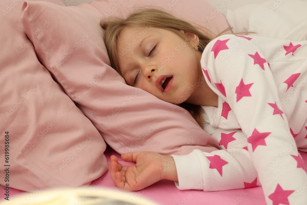 Little girl snoring while sleeping in bed Stock Photo | Adobe Stock