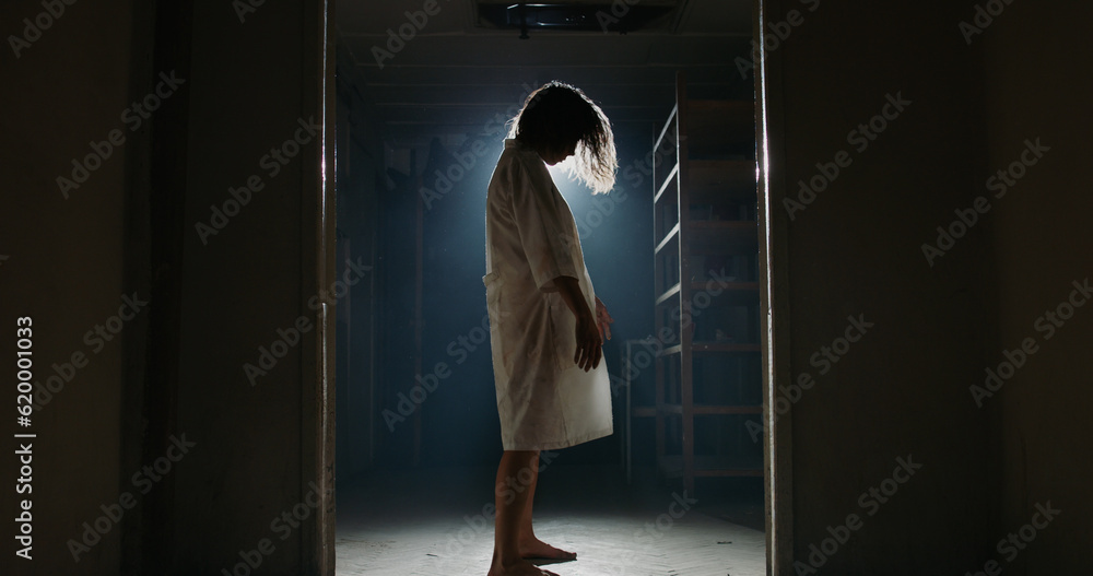 Exhorcist girl in white shirt slowly creeping in haunted hallway ...