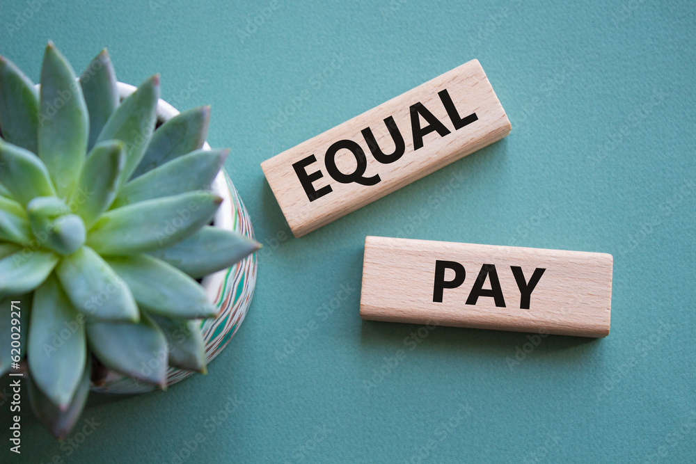 Equal Pay symbol. Wooden blocks with words Equal Pay. Beautiful grey ...