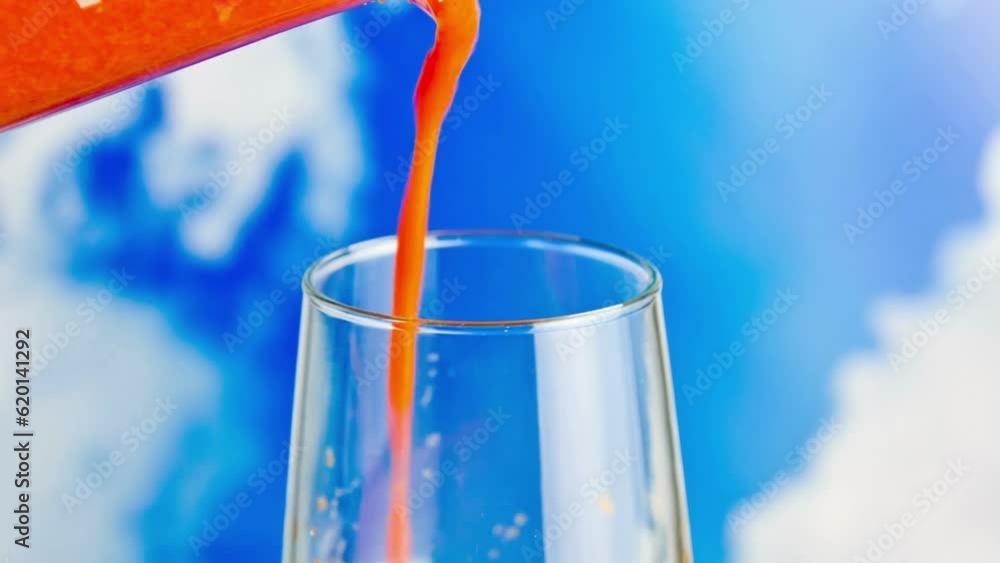 Refreshing Nectar: Close-Up of Freshly Blended Fruit Juice Pouring into ...