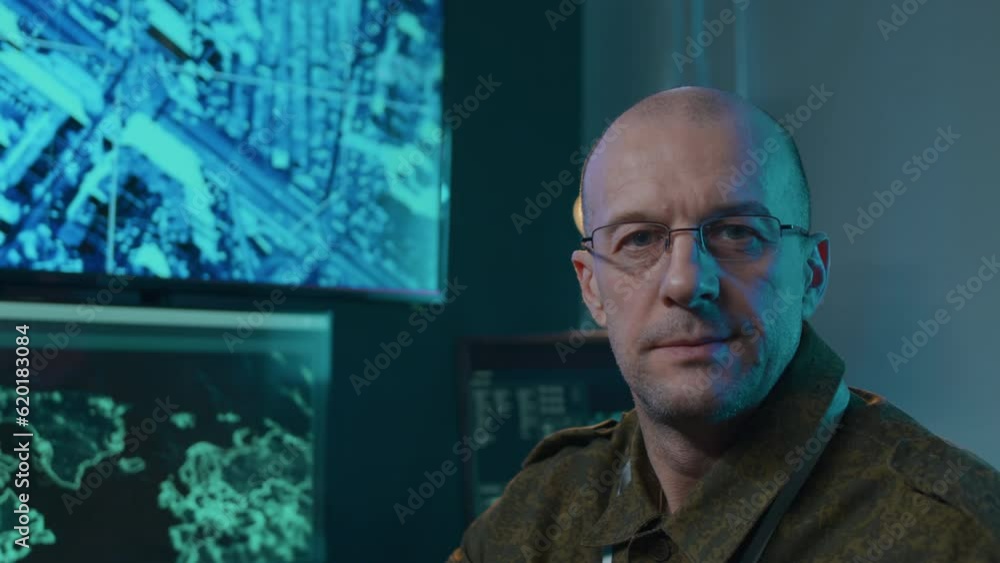 Close up portrait of male Caucasian military officer sitting at desk in ...