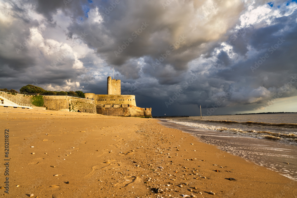Fort Vauban de Fouras as seen from the Grande Plage beach during sunset ...
