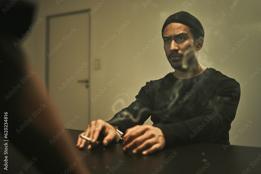 Man in investigation, smoking and detective in interrogation room with ...