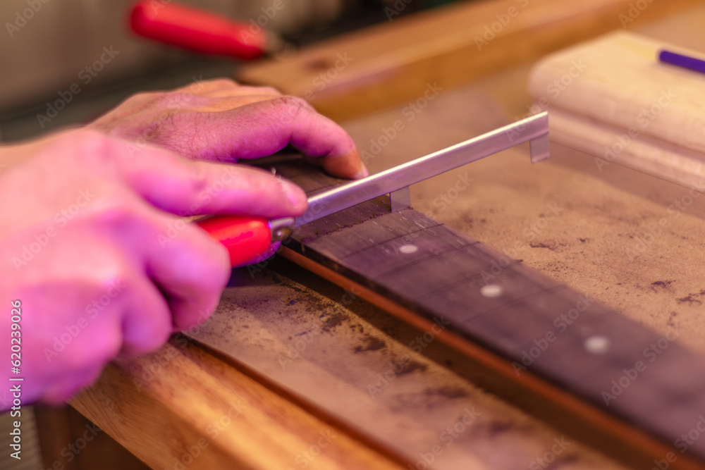 Unstrung Guitar Fretboard and Tiny Refret Saw with Blue and Red Light ...
