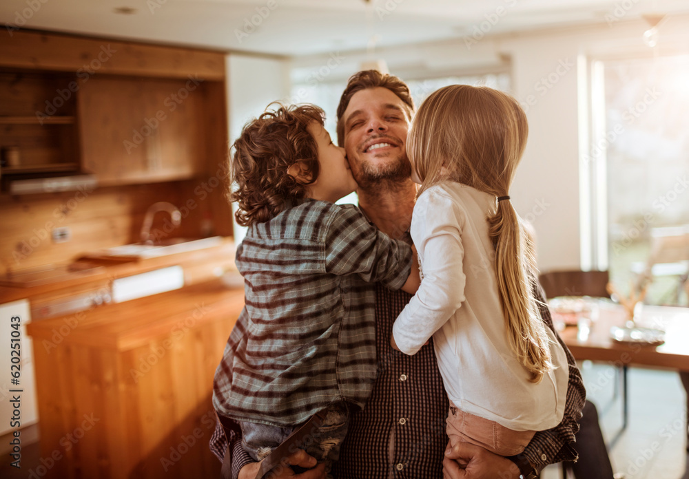 Father hugging and kissing his kids at home in the living room Stock ...