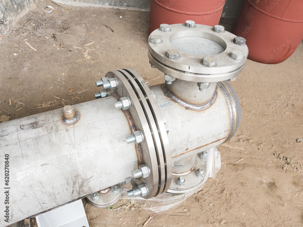 Compact stainless steel shell-and-tube heat exchanger flange close up ...