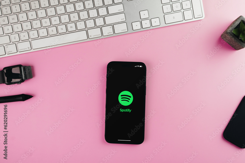 Spotify Music App On The Smartphone Iphone 14 Pro Screen On Pink Table Top View Office