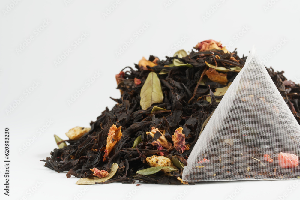 A pyramid-shaped tea bag with flavored black tea, with the addition of ...