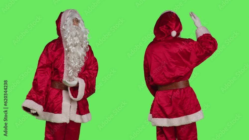 Santa claus cosplay shows advertisement, pointing aside while he poses ...