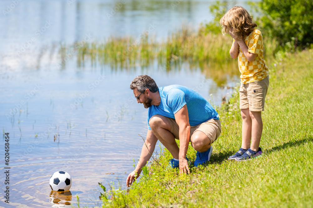 son has bonding time with father outdoor. favorite activity. Father and son enjoy a friendly ...