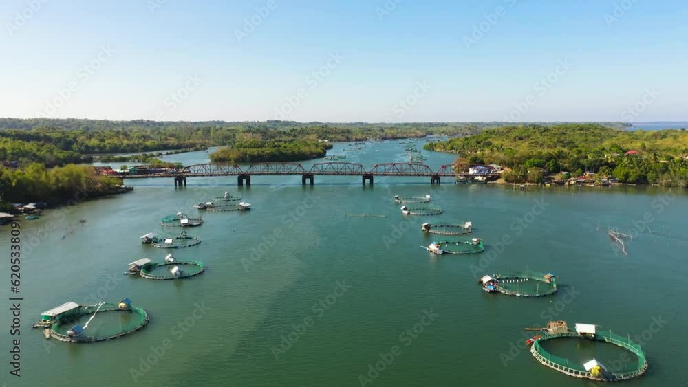 Fish farm with cages for fish and shrimp. Fish ponds for bangus ...