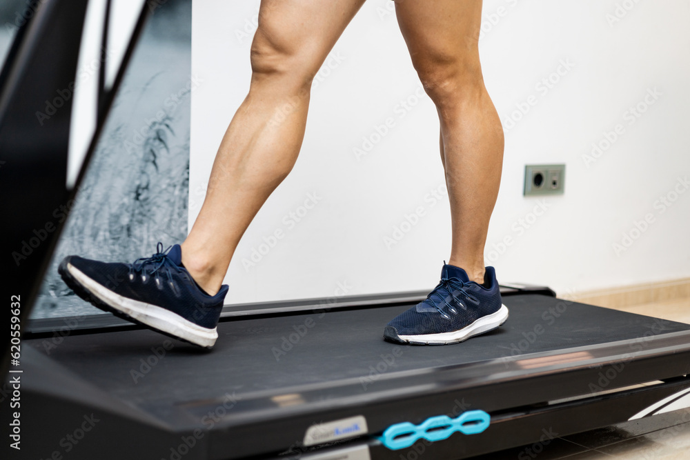 A photo of some legs that are walking on a treadmill for a ...