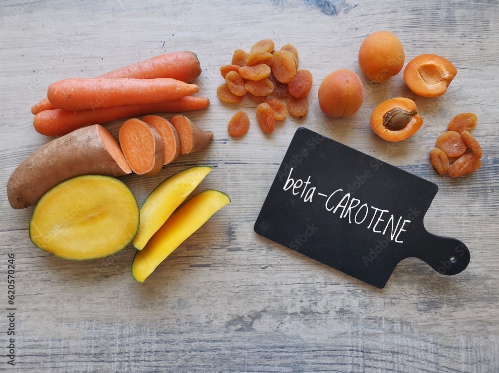 Food rich in beta carotene with text Beta Carotene. Various fruits and ...