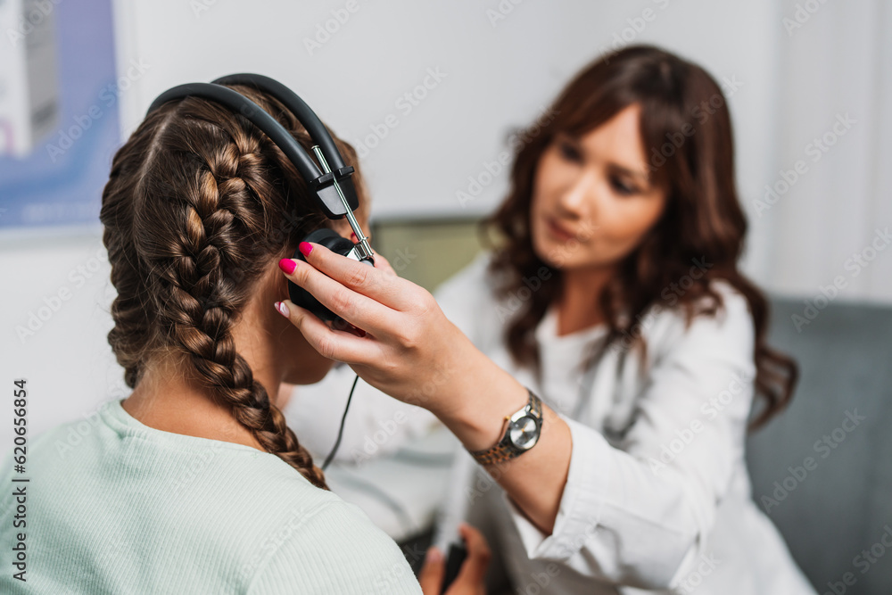 Audiologist doing impedance audiometry or diagnosis of hearing ...
