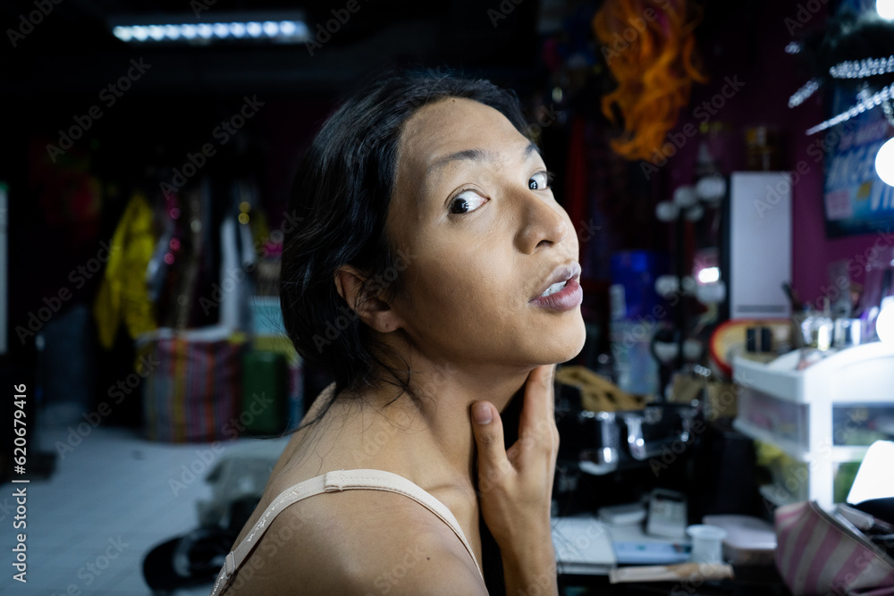 A candid photo of a transgender artist getting ready behind the scenes ...