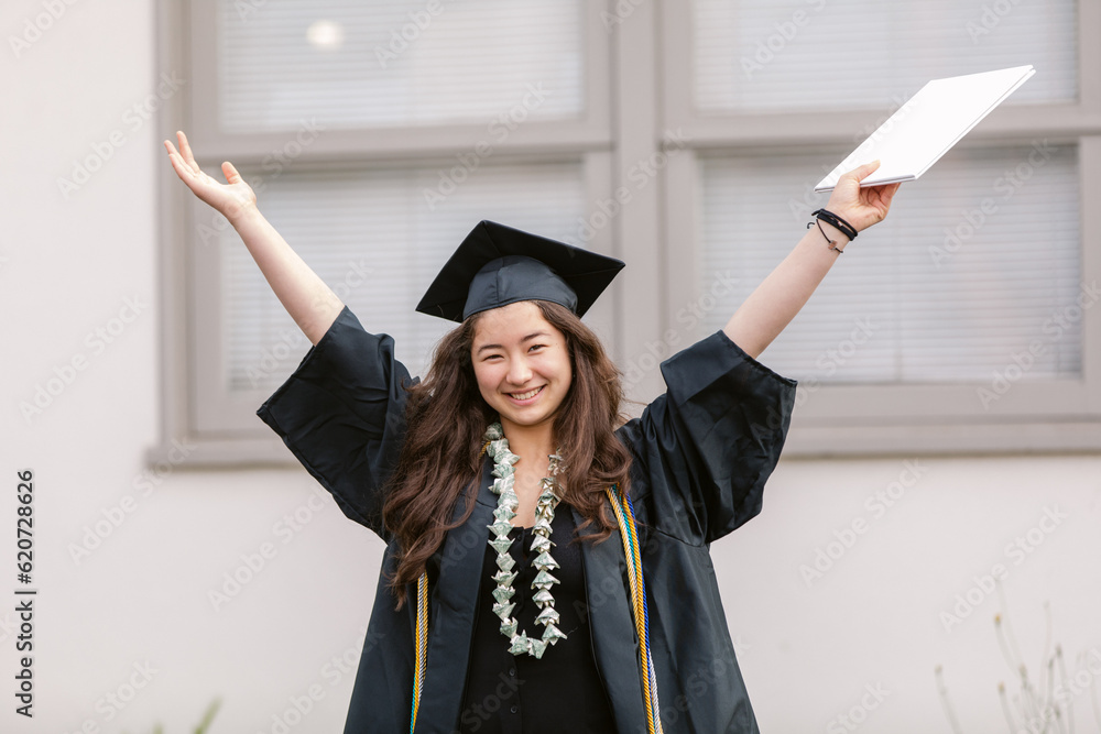 Happy high school girl graduation day Stock Photo | Adobe Stock