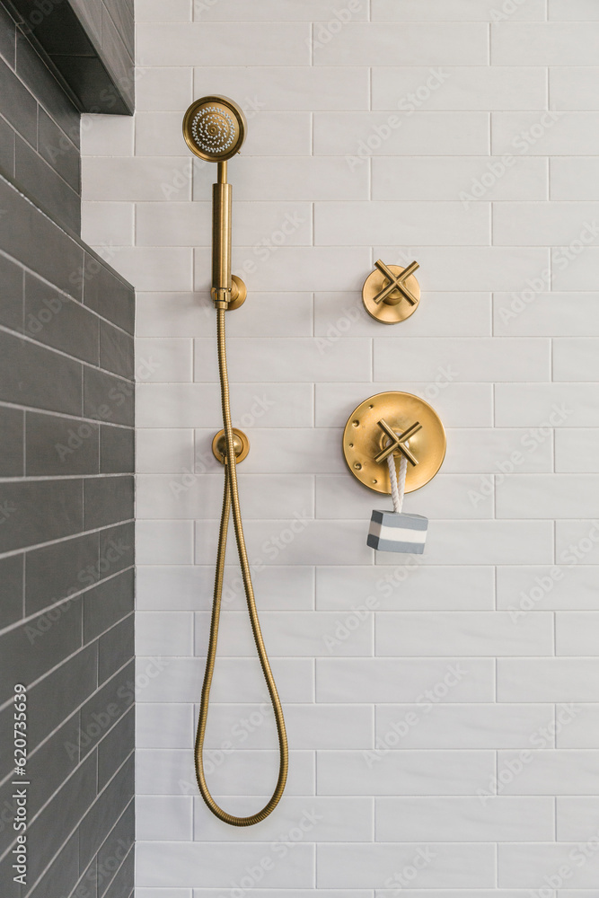 Tile Shower in bathroom with gold faucet in house Stock Photo | Adobe Stock