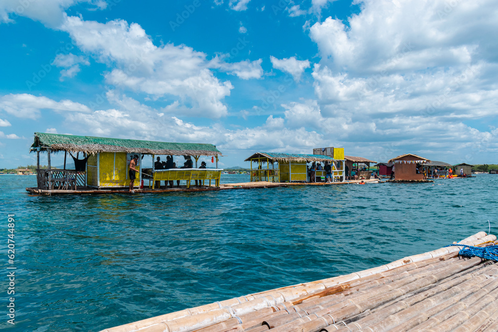 Floating houses on a turquoise Calatagan beach. Batangas, Philippines ...