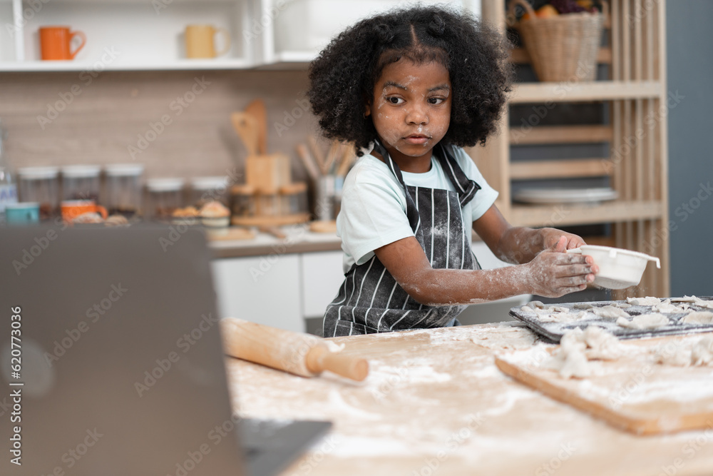 Happy African American kid girl learning cooking break or bakery of ...