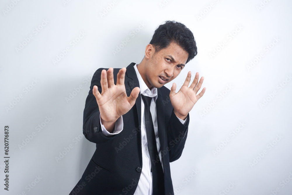 Keep it away from me. Portrait of reluctant and displeased young asian ...