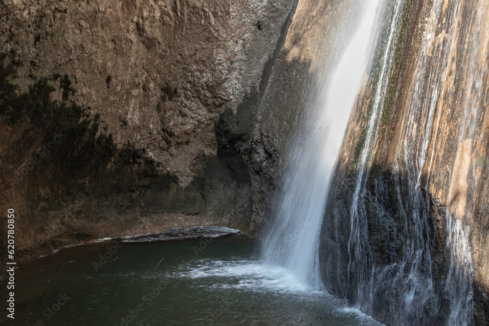 HaTanur waterfall flows from a crevice in the mountain and is located ...