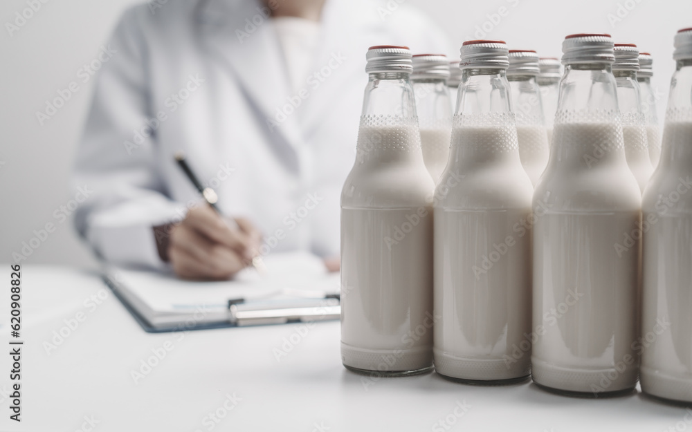 Quality control laboratory dairy factory professional people checking ...