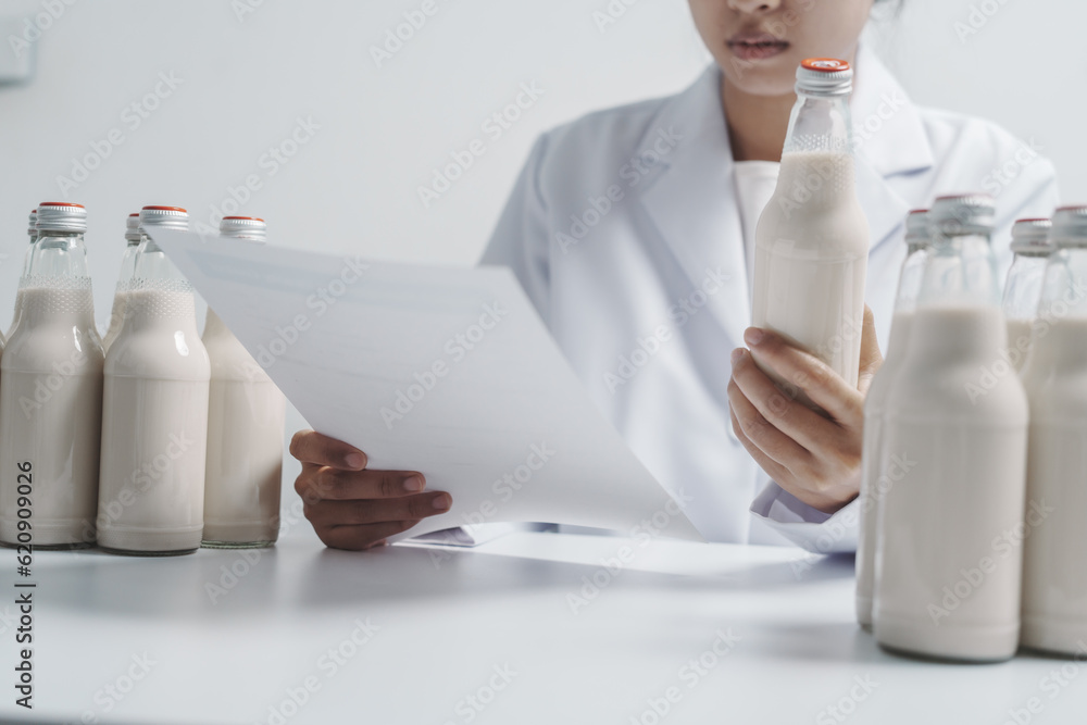 Quality control laboratory dairy factory professional people checking ...