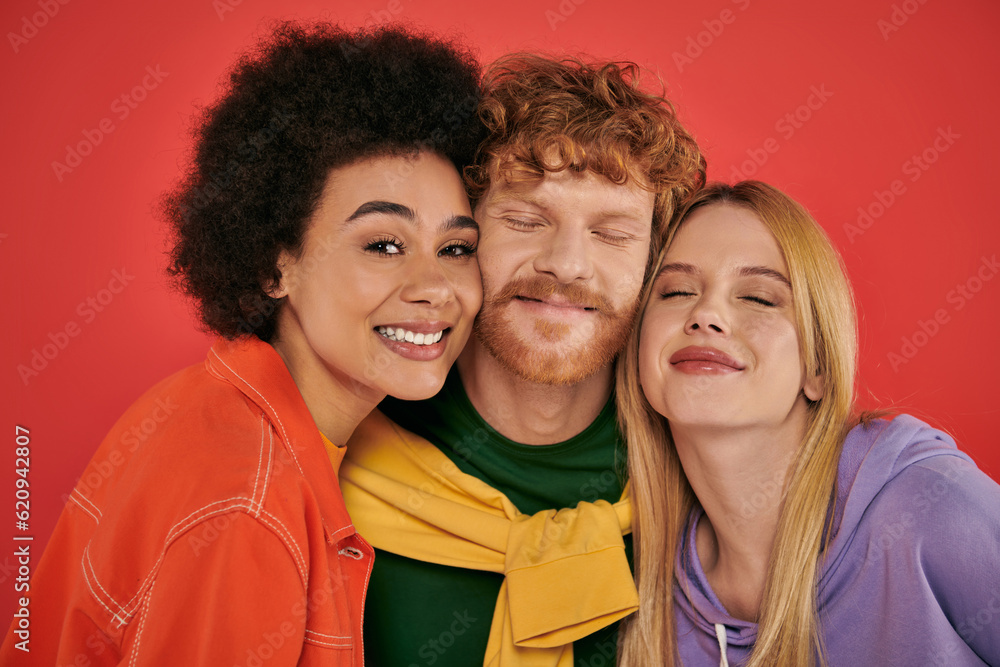 polyamorous concept, portrait of young man and multicultural women on ...