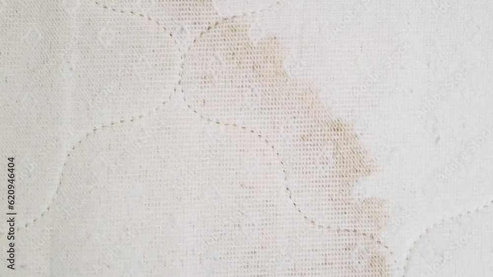 dirty mattress. Dirty yellow spots on the mattress of the bed, bed with ...
