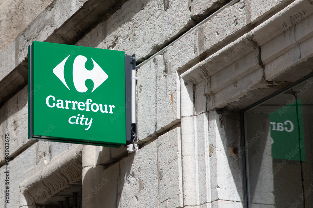 Carrefour city text logo and brand sign on facade store entrance of ...