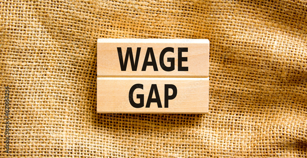 Wage gap symbol. Concept words Wage gap on wooden blocks on a beautiful ...