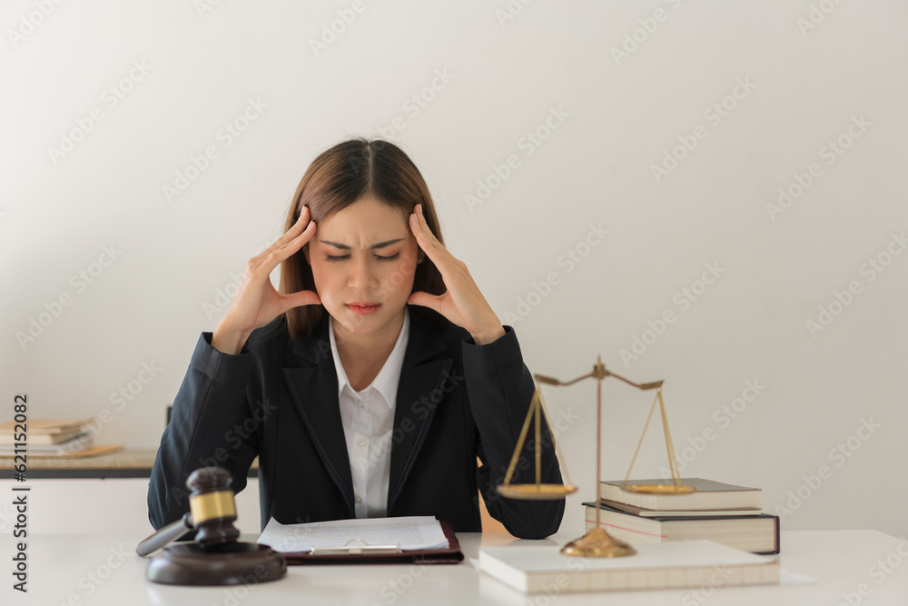 Foto de Law and justice concept, Female lawyer feel stress and headache ...