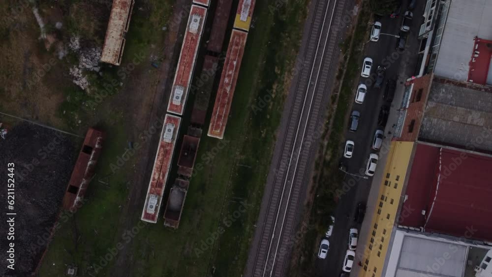 Drone flies over the railway station, railway tracks, flock of birds ...