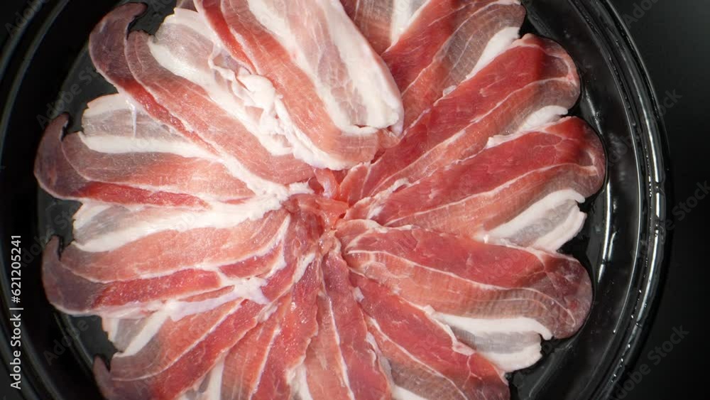 Raw pork belly slices: thin, marbled cuts of tender pork belly ...