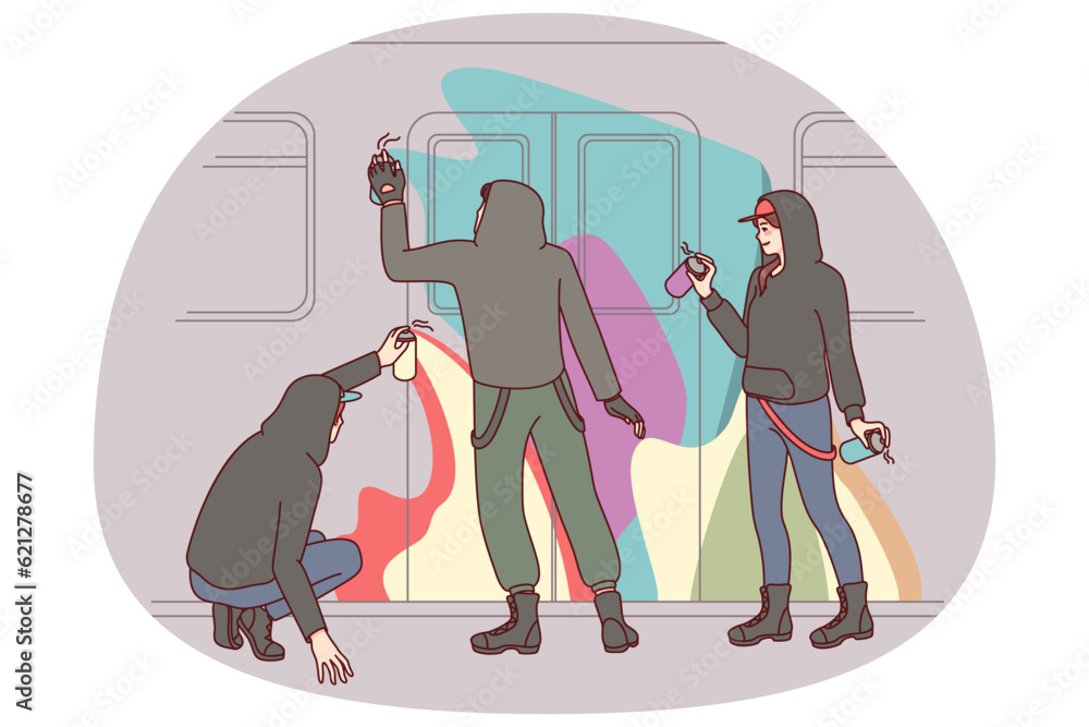 People painting subway train with graffiti. Vandals drawing subculture ...
