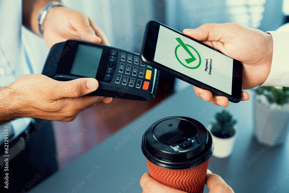 Hand holding smartphone with NFC QR code device, scanning contactless ...