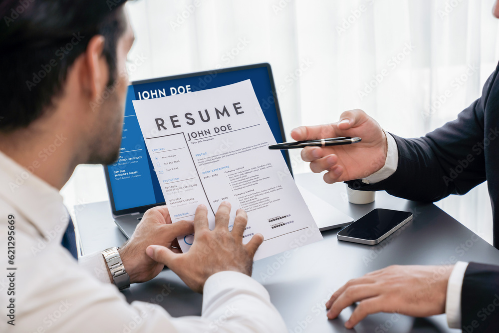 Interviewing job applicant in office with resume paper. Candidate wear ...