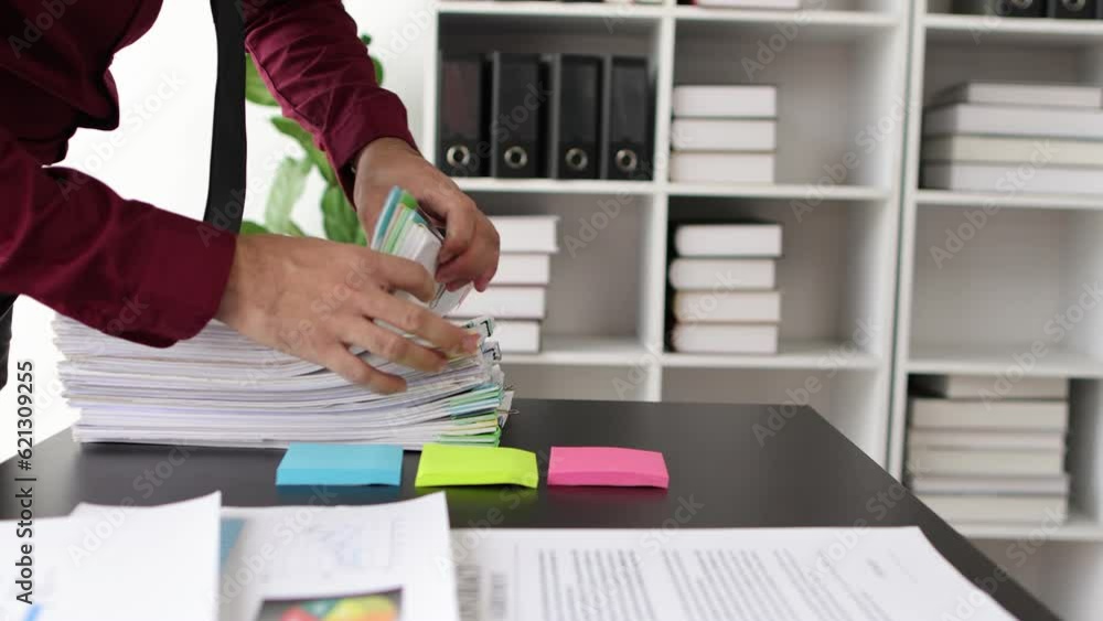 Business people working on paperwork in the office are reading and ...