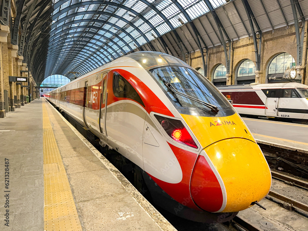 London, England, UK - 27 June 2023: High speed train alongside one of ...