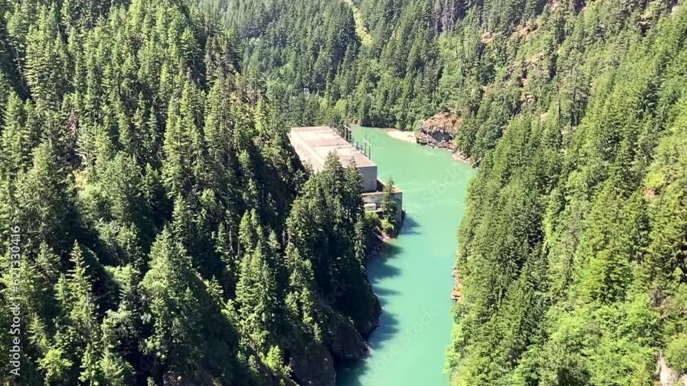 Tilt up shot from the top of Ross Dam to show the flowing river below ...