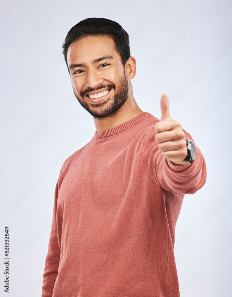 Thumbs up, portrait and man vote for success in studio, white ...