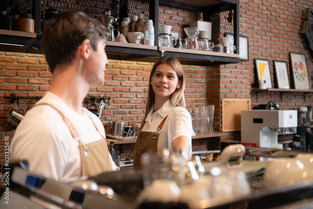 Barista working in cafe. Portrait of young male barista standing behind ...