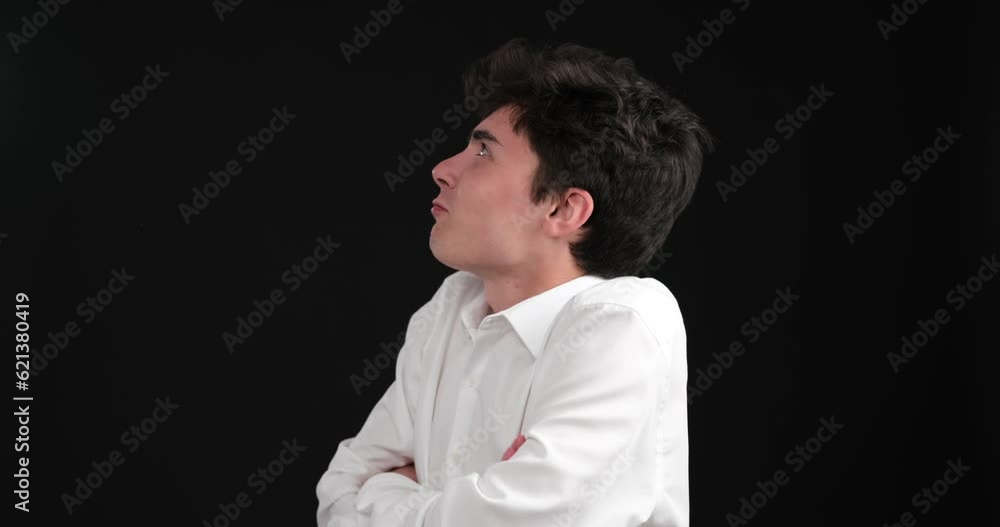 Offended Caucasian man stands on black background with a visible ...