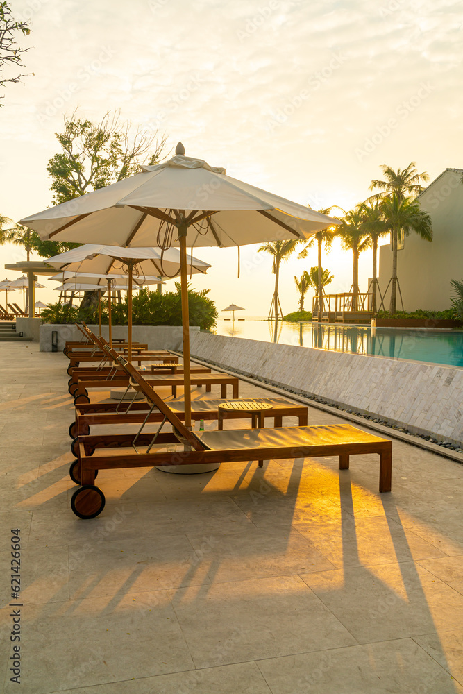 umbrella with bed pool around swimming pool with ocean sea background ...