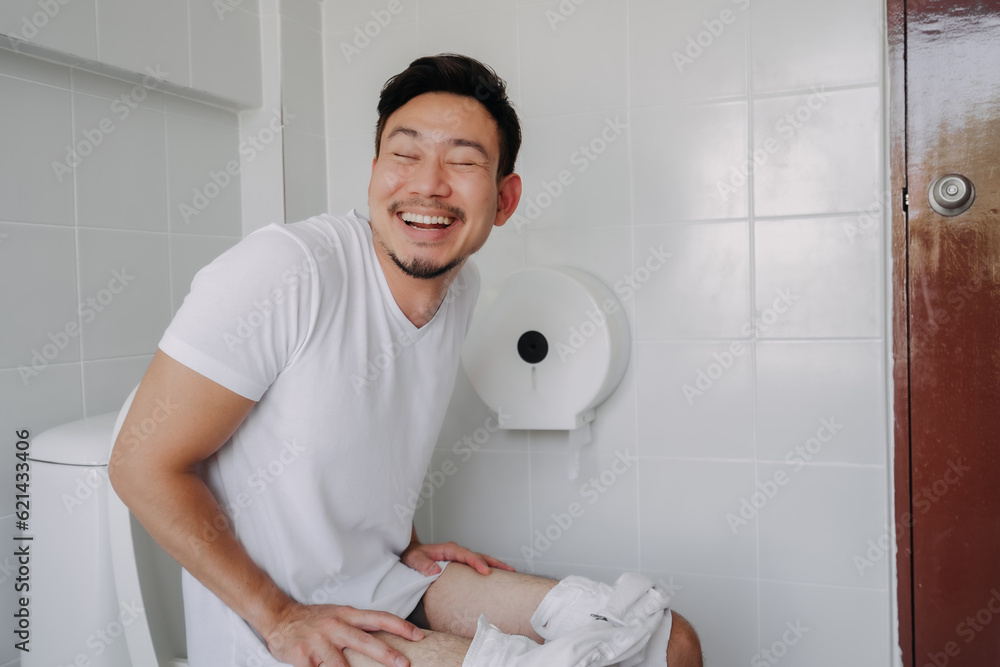 Funny happy face of asian man able to poop after suffer from ...
