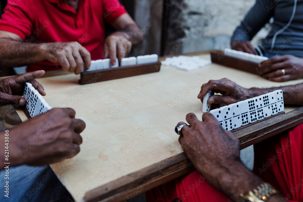 hands of group of elderly men playing dominoes in Old Havana Cuba, Afro ...