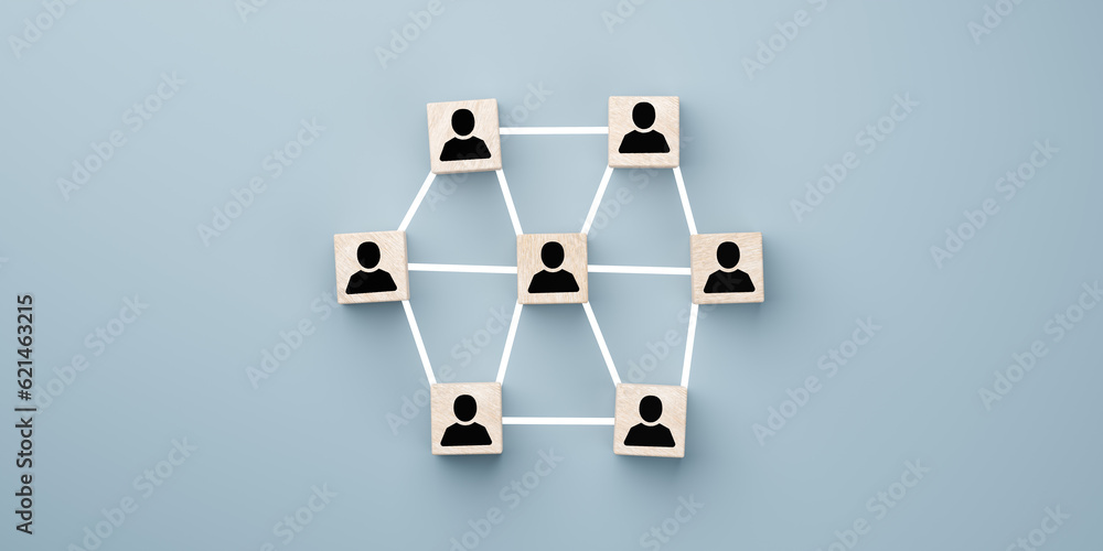Linking entities, Hierarchy and HR. Wooden blocks connected together on ...