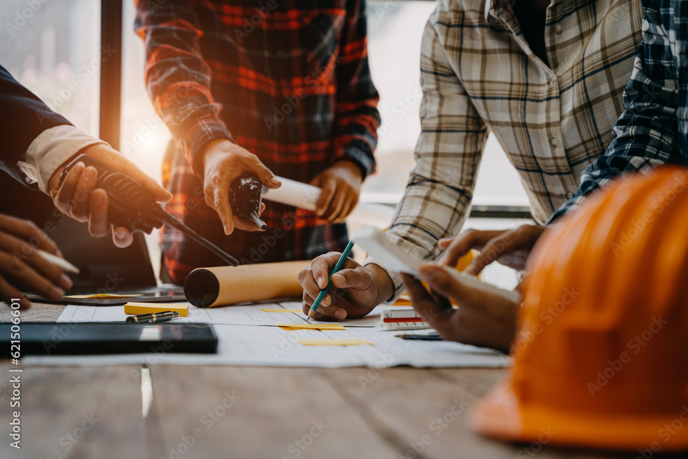 Engineer teams meeting working together wear worker helmets hardhat on ...