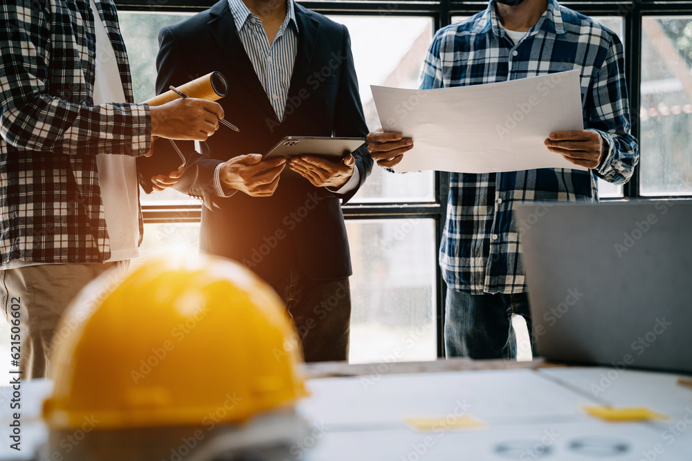 Engineer teams meeting working together wear worker helmets hardhat on ...