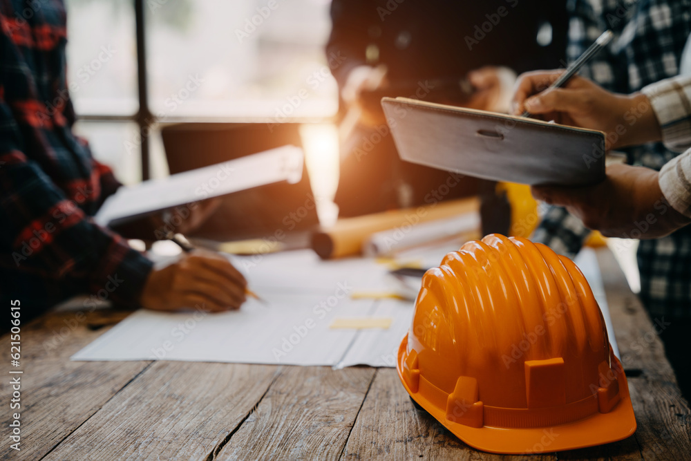 Engineer teams meeting working together wear worker helmets hardhat on ...